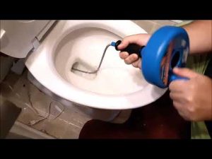How to Use a Plumbing Snake to Clear a Toilet (Step-by-Step Guide ...